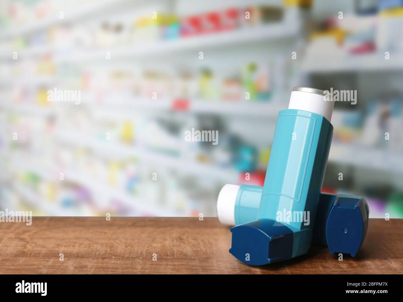 Concept of health care and asthma. Inhalers on counter at pharmacy ...