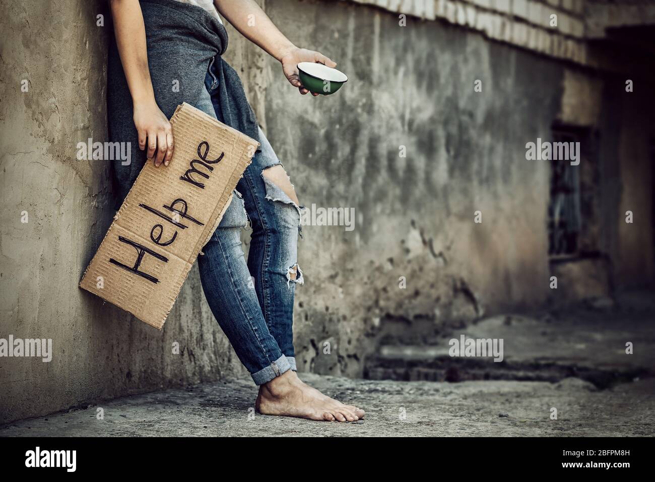 Poverty concept. Poor woman begging for help and money on street Stock ...