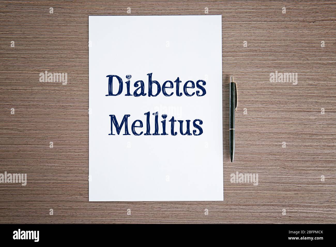 Health care concept. Sheet of paper with text DIABETES MELLITUS and pen ...