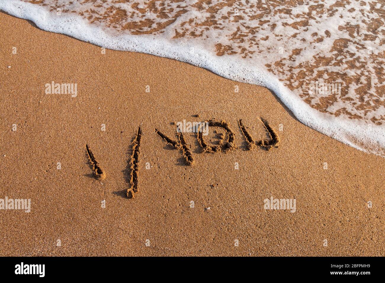Romantic love lettering and heart sign on the beach beach Stock Photo ...