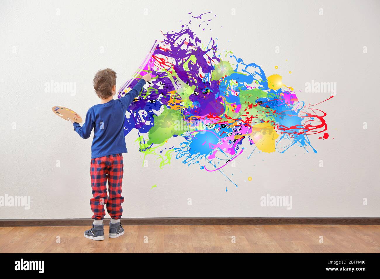 Childhood concept. Little painter drawing abstract picture on white ...