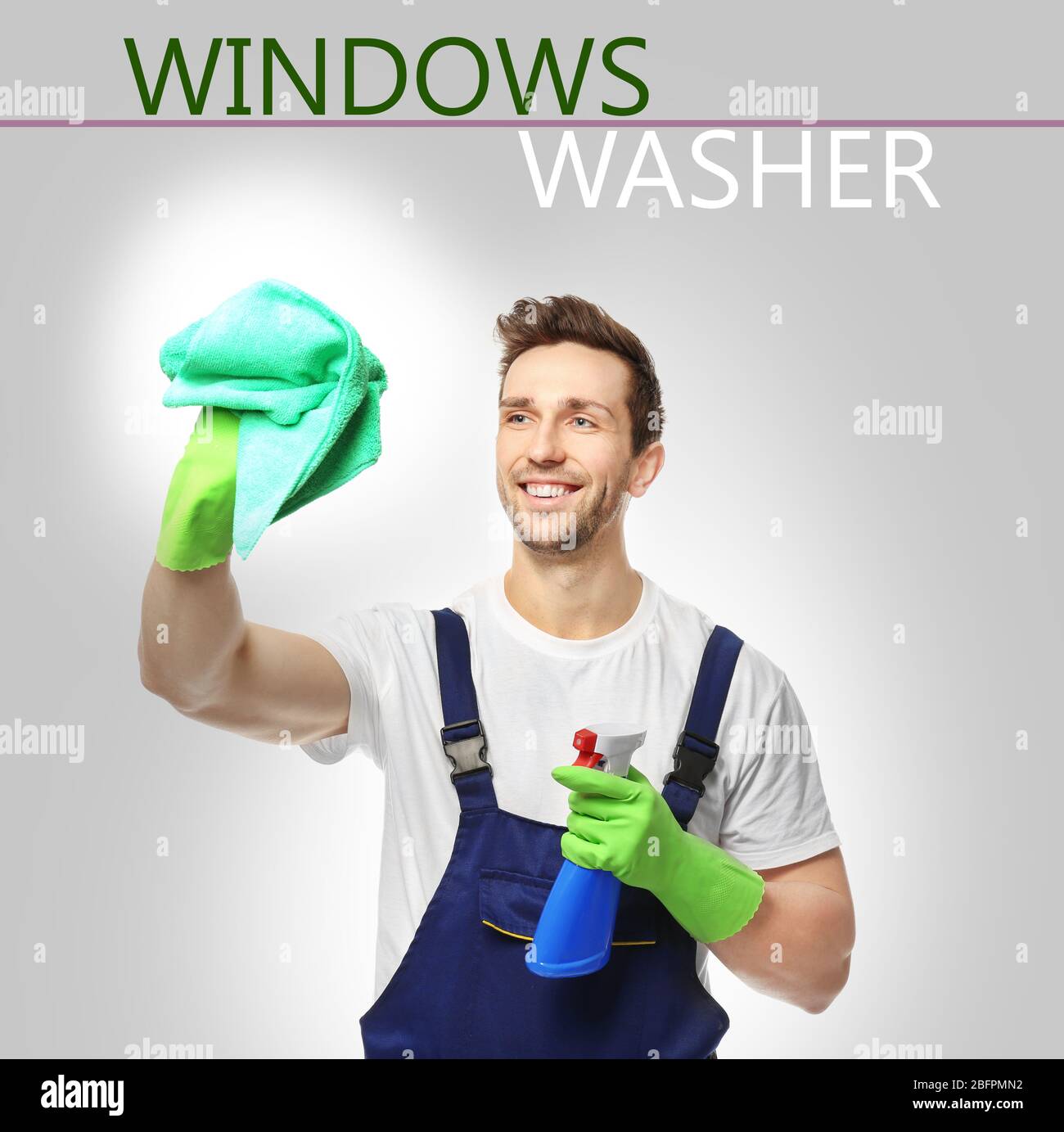 Young window cleaner with supplies on gray background Stock Photo - Alamy