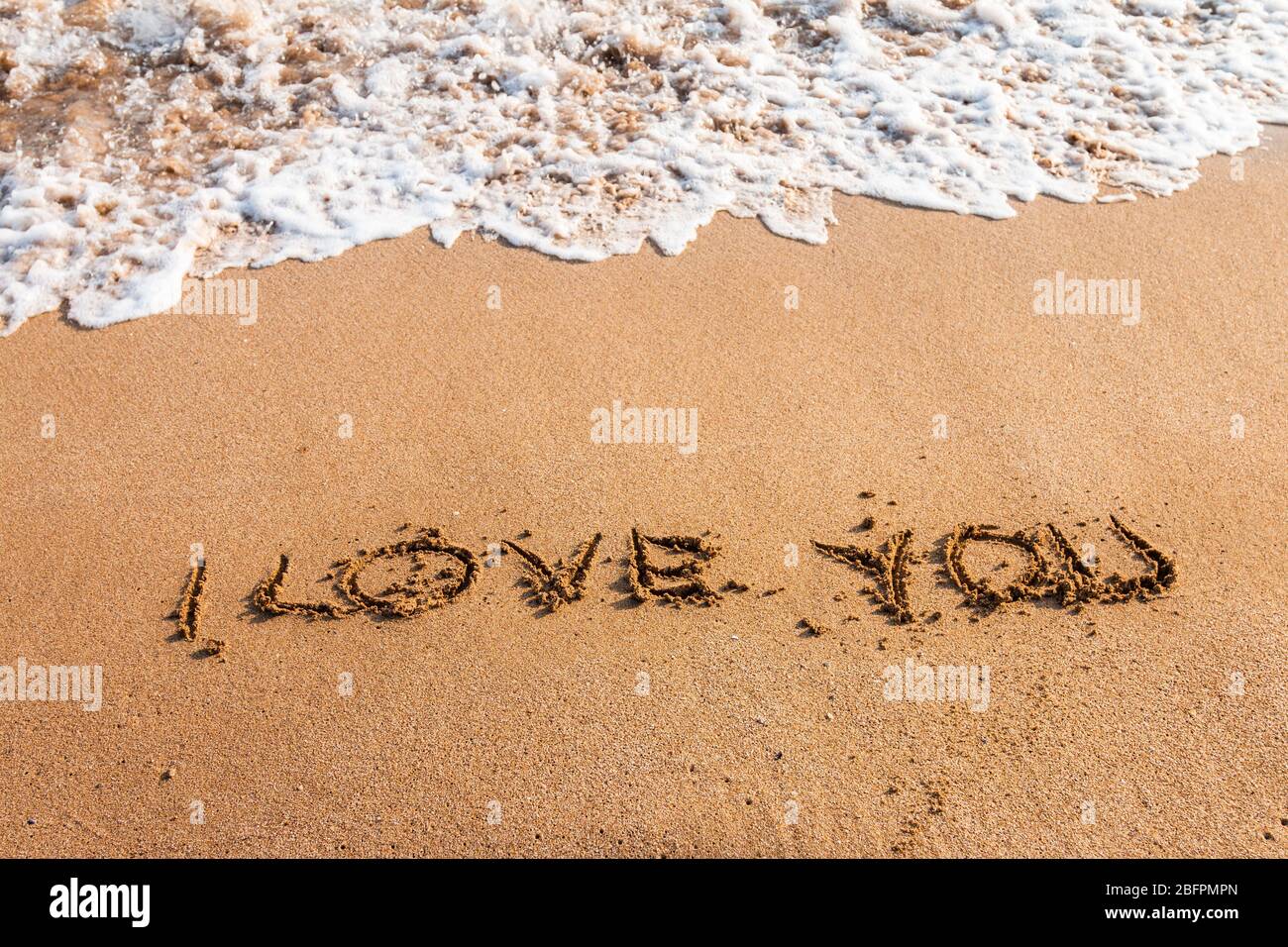 Romantic love lettering and heart sign on the beach beach Stock Photo ...