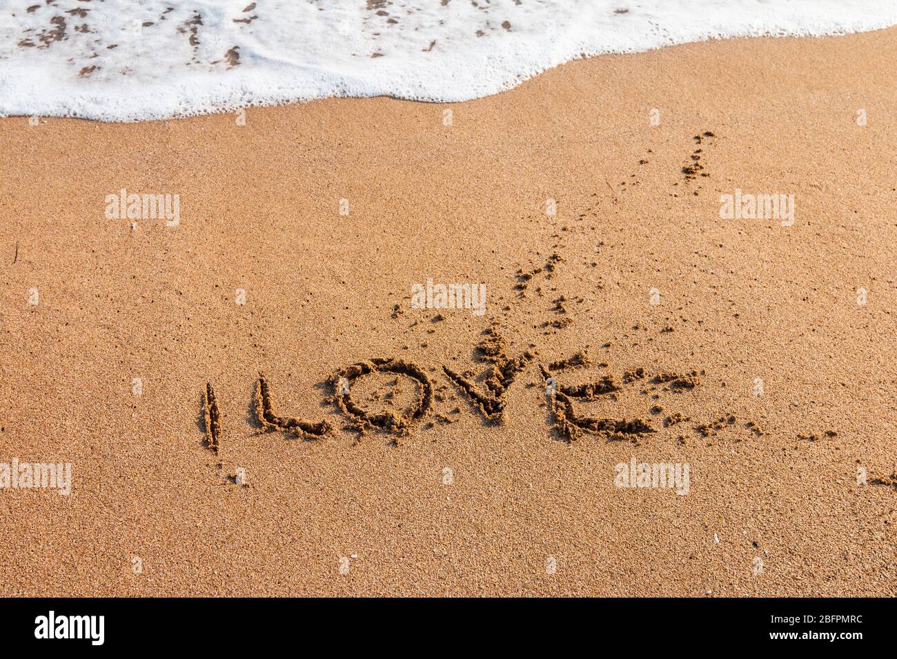 Romantic love lettering and heart sign on the beach beach Stock Photo ...