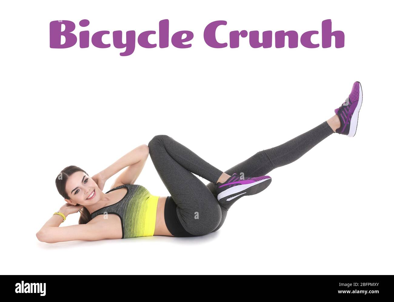 Young woman doing bicycle crunch on white background Stock Photo - Alamy