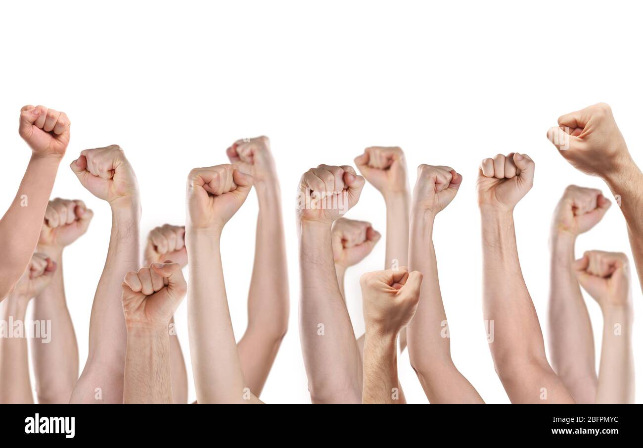 Raised human hands with clenched fists on white background. Strike and ...