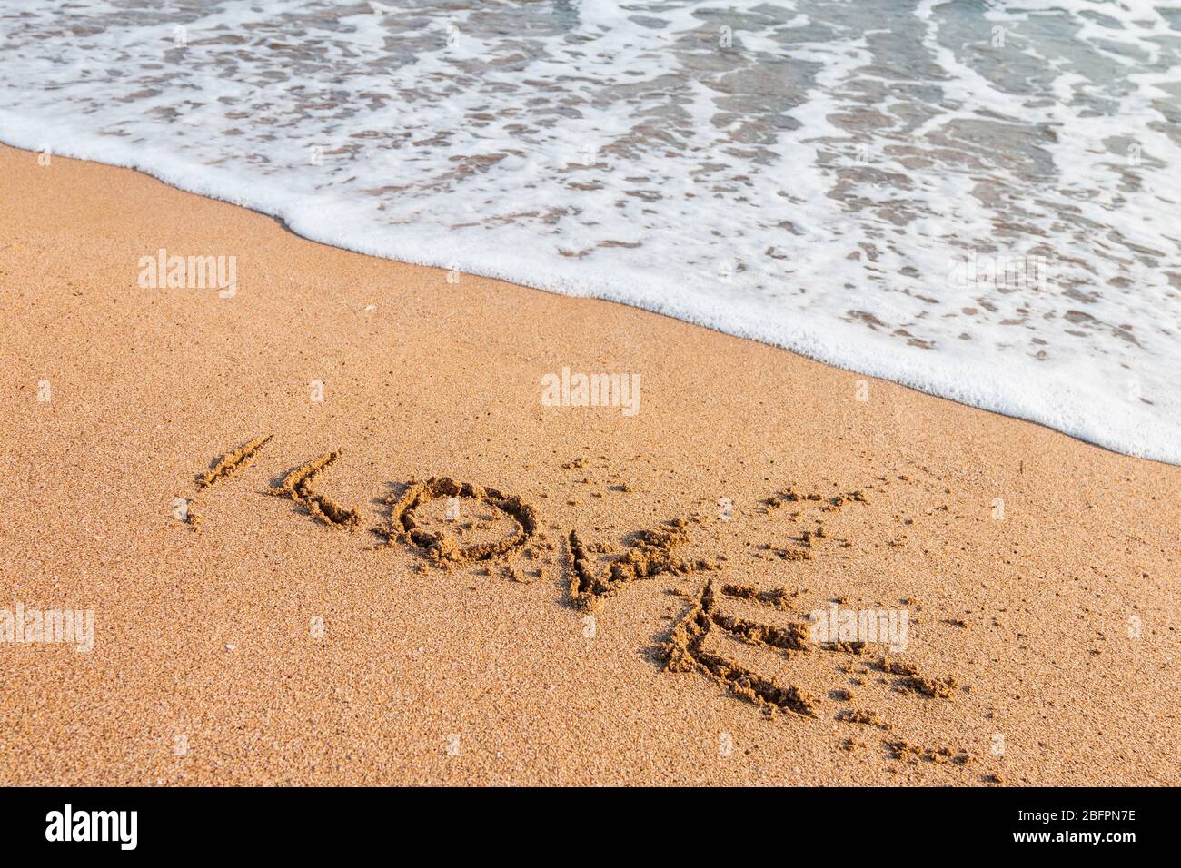 Romantic love lettering and heart sign on the beach beach Stock Photo ...