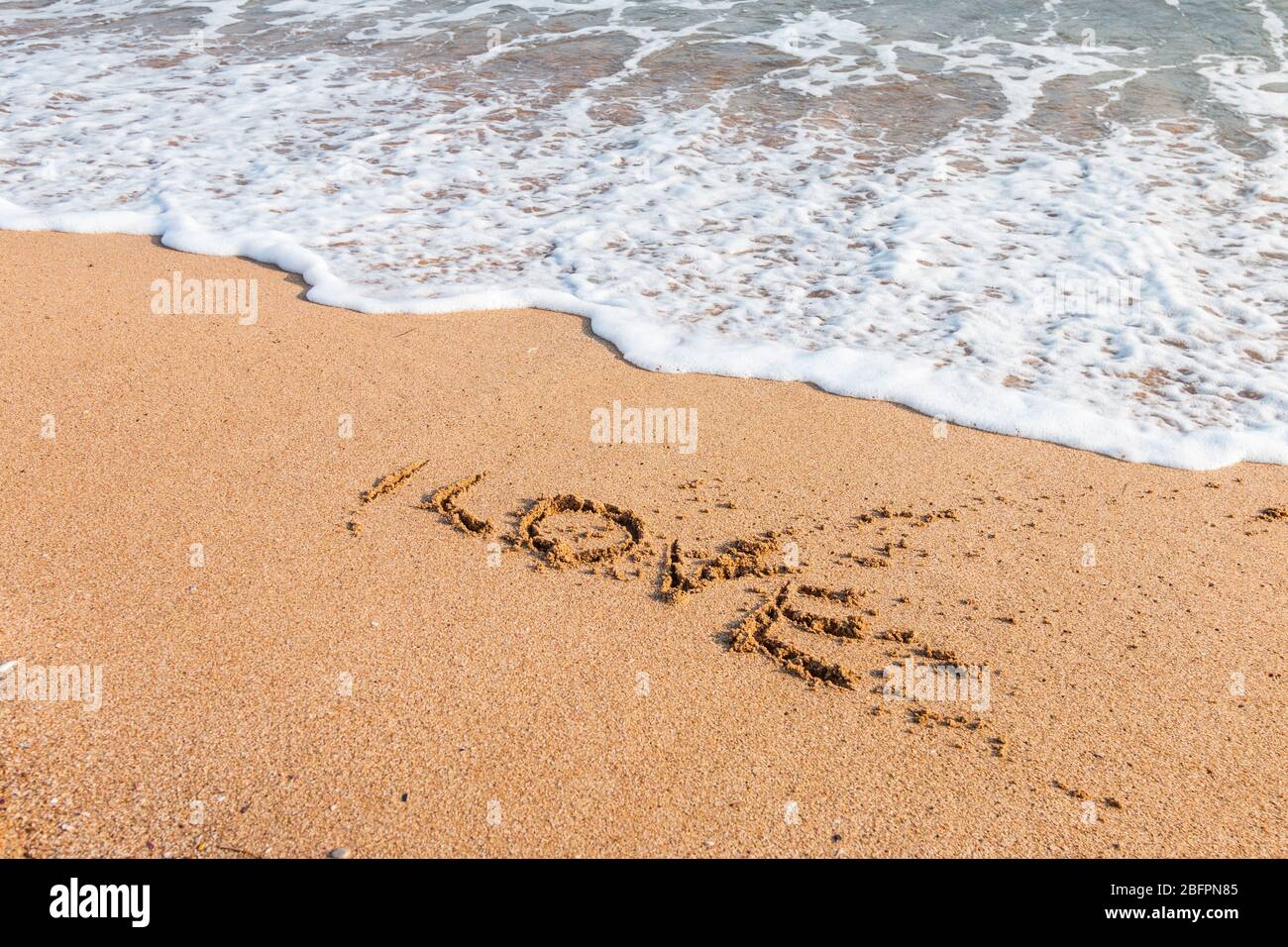 Romantic love lettering and heart sign on the beach beach Stock Photo ...