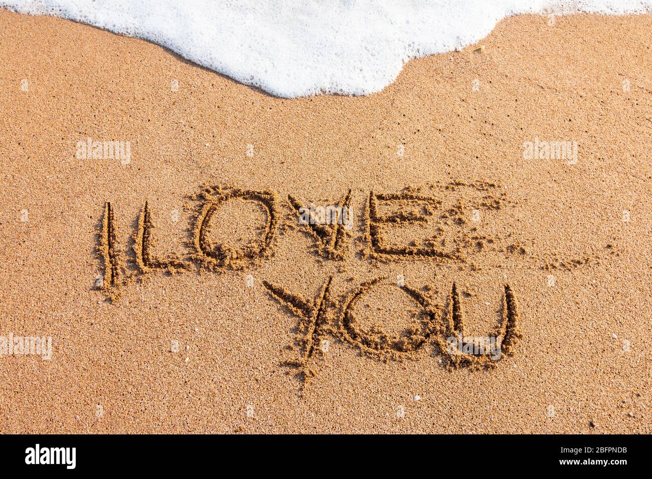Romantic love lettering and heart sign on the beach beach Stock Photo ...