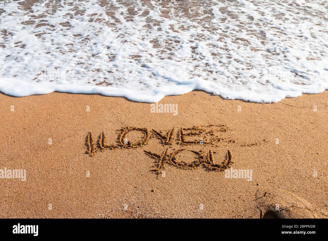 Romantic love lettering and heart sign on the beach beach Stock Photo ...