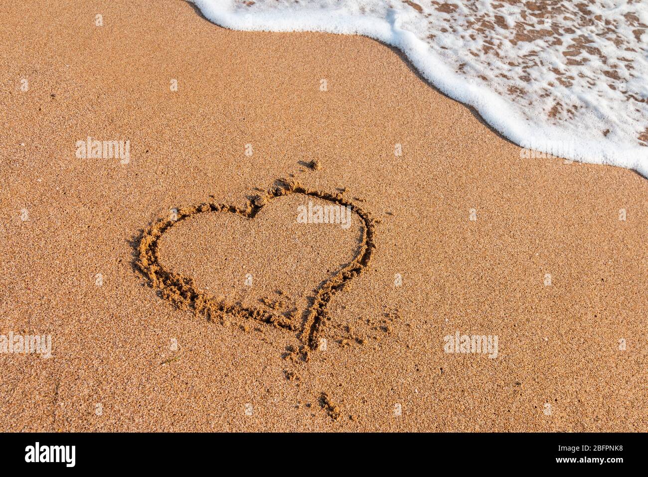 Romantic love lettering and heart sign on the beach beach Stock Photo ...