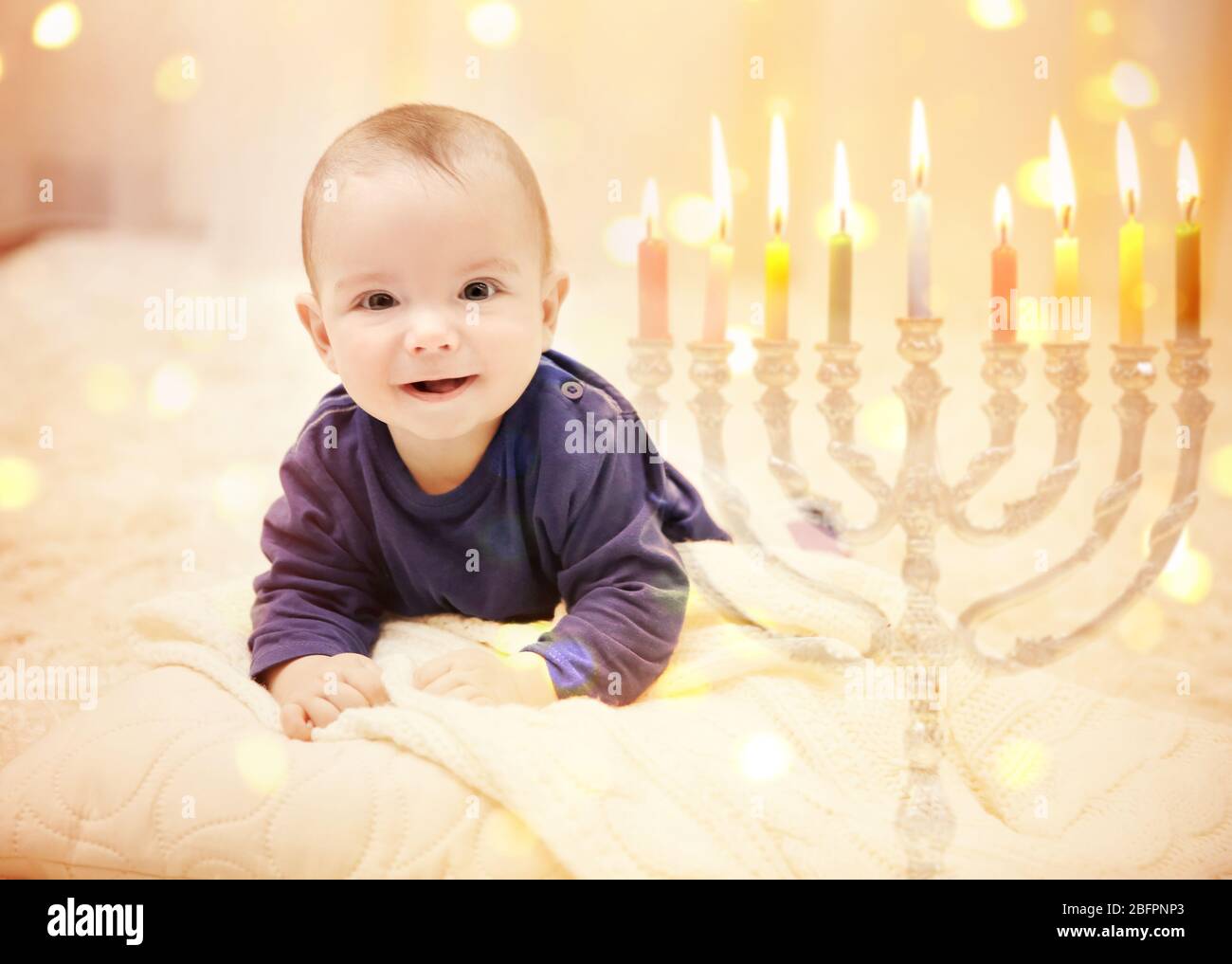 Little child on blurred festive lights background. Baby's First ...