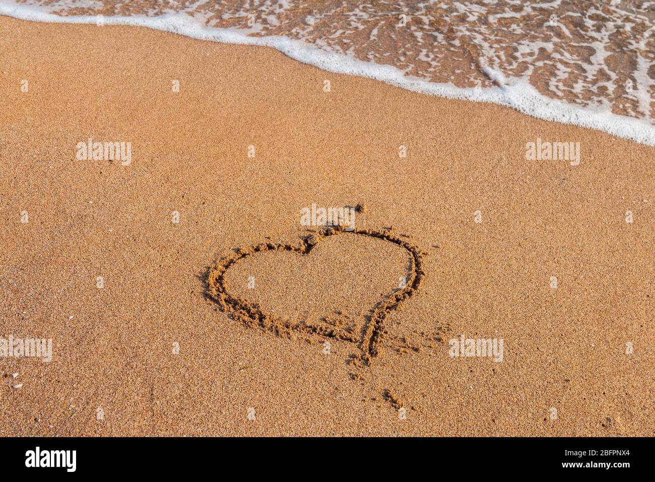Romantic love lettering and heart sign on the beach beach Stock Photo ...