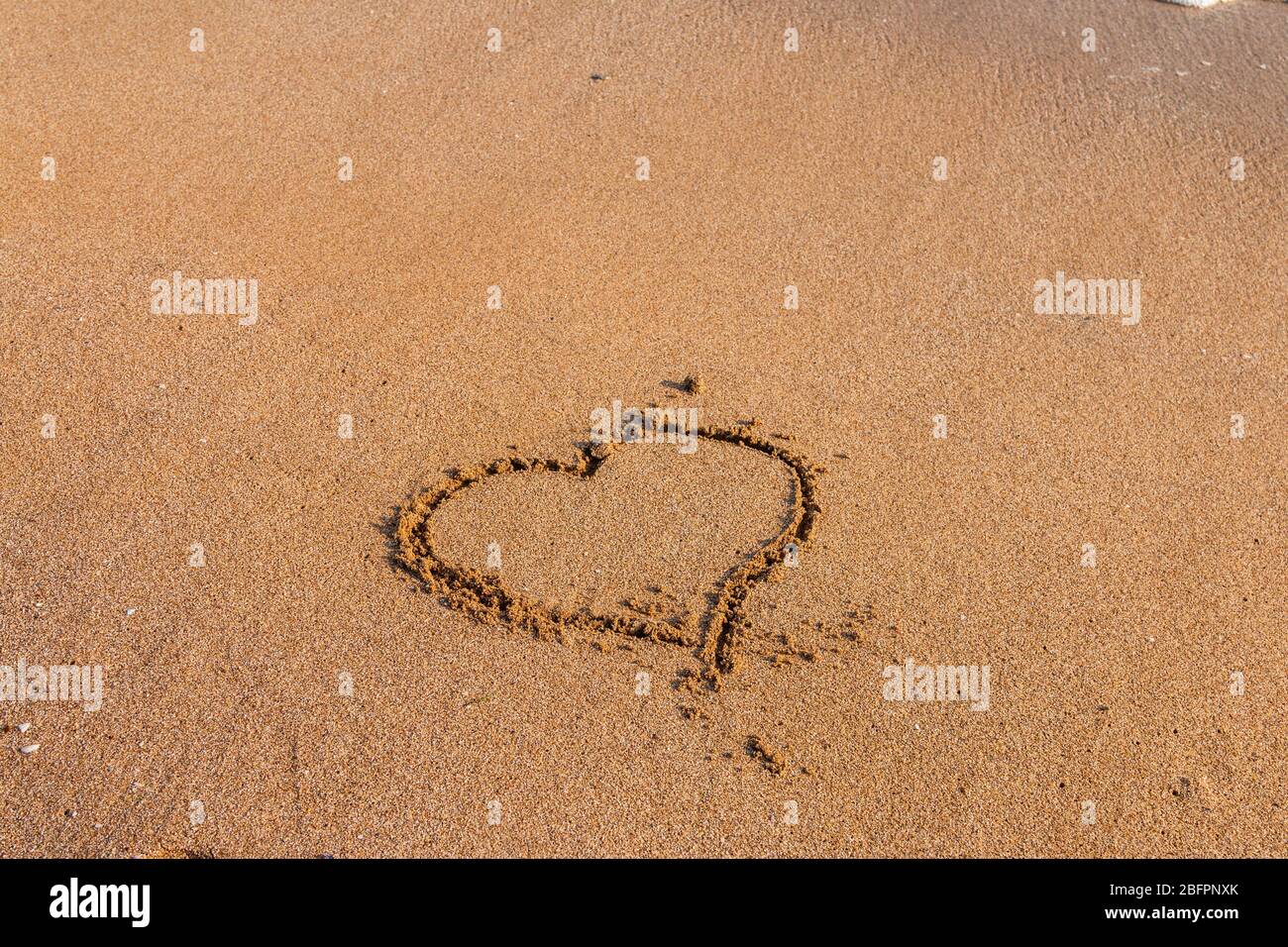 Romantic love lettering and heart sign on the beach beach Stock Photo ...