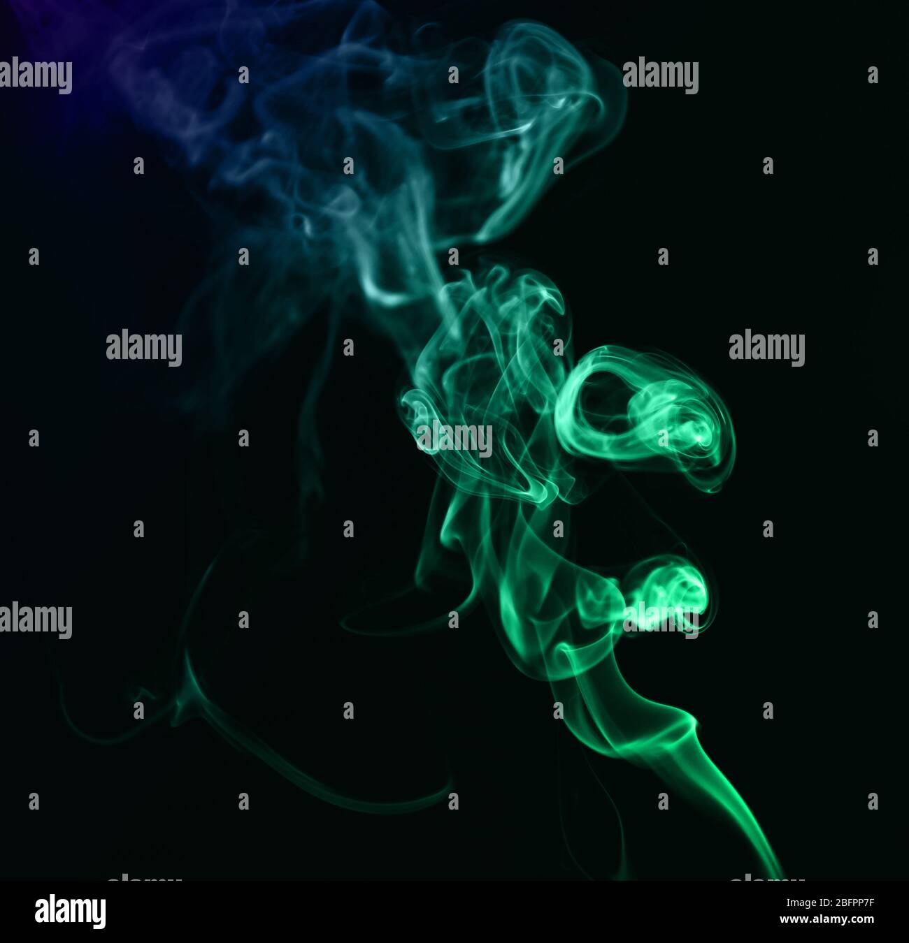 Swirl of color smoke on black background Stock Photo - Alamy