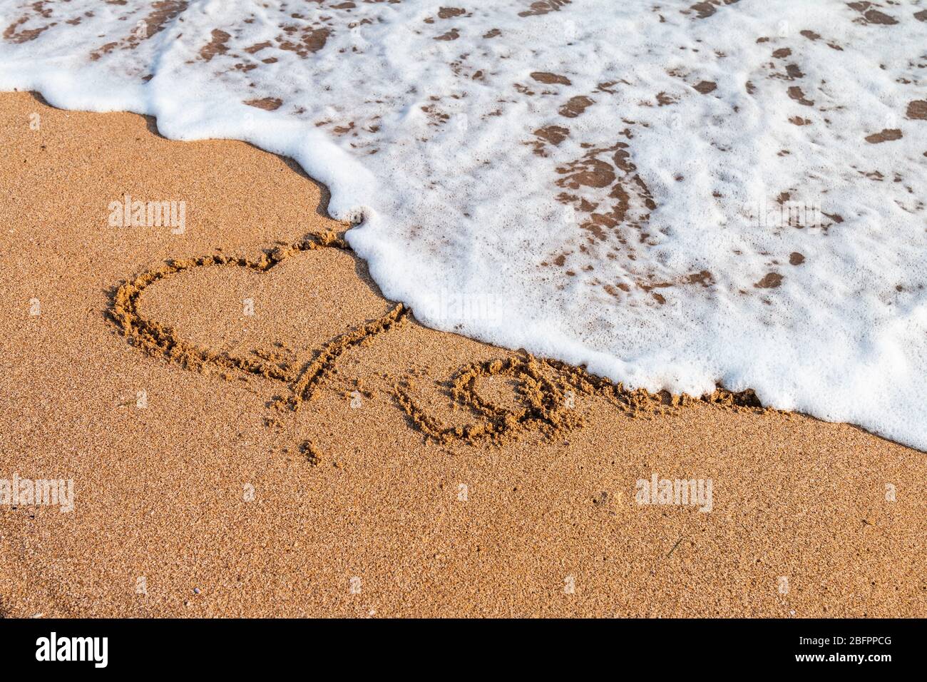 Romantic love lettering and heart sign on the beach beach Stock Photo ...