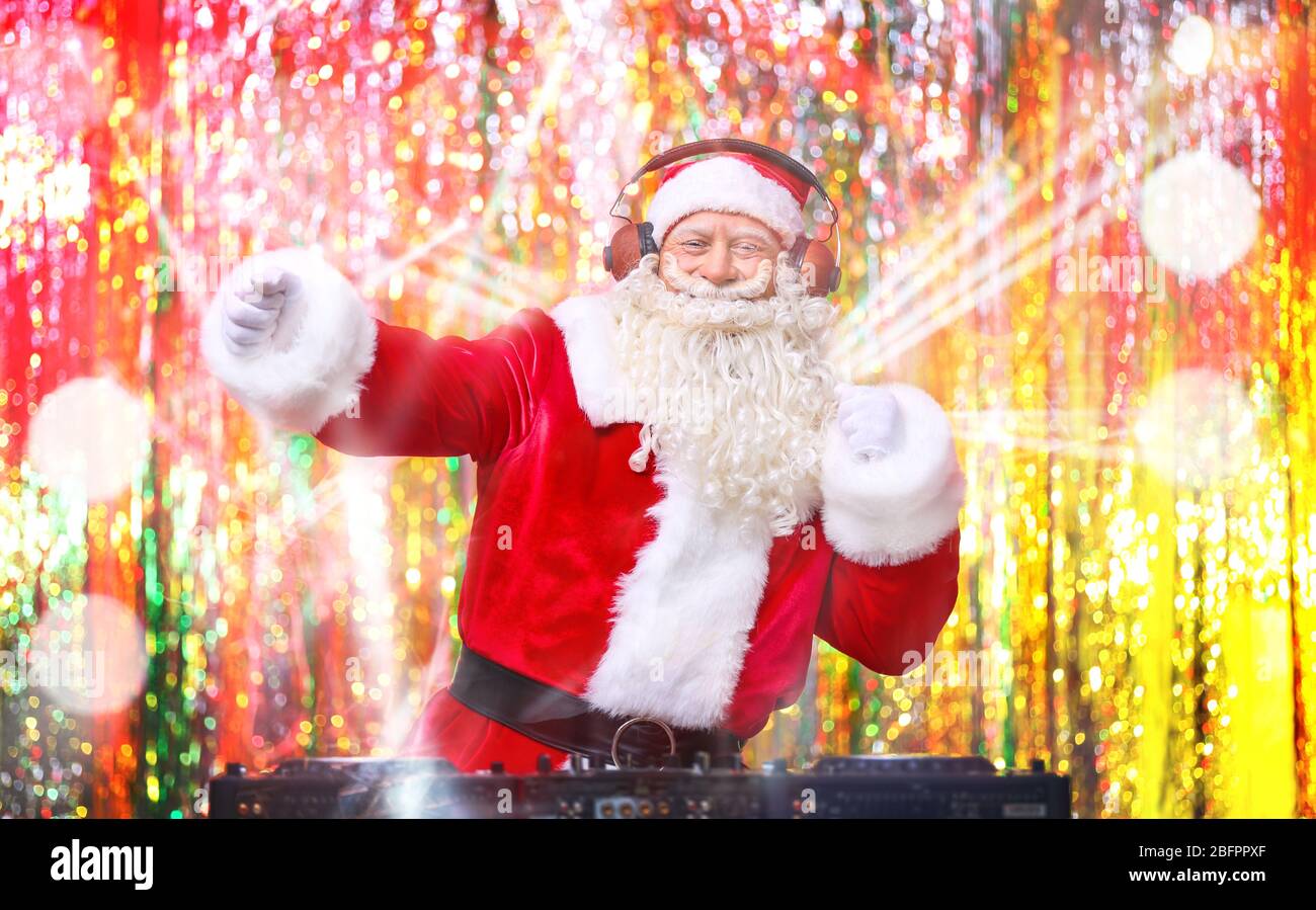 Santa Claus performing in nightclub at Christmas party Stock Photo - Alamy