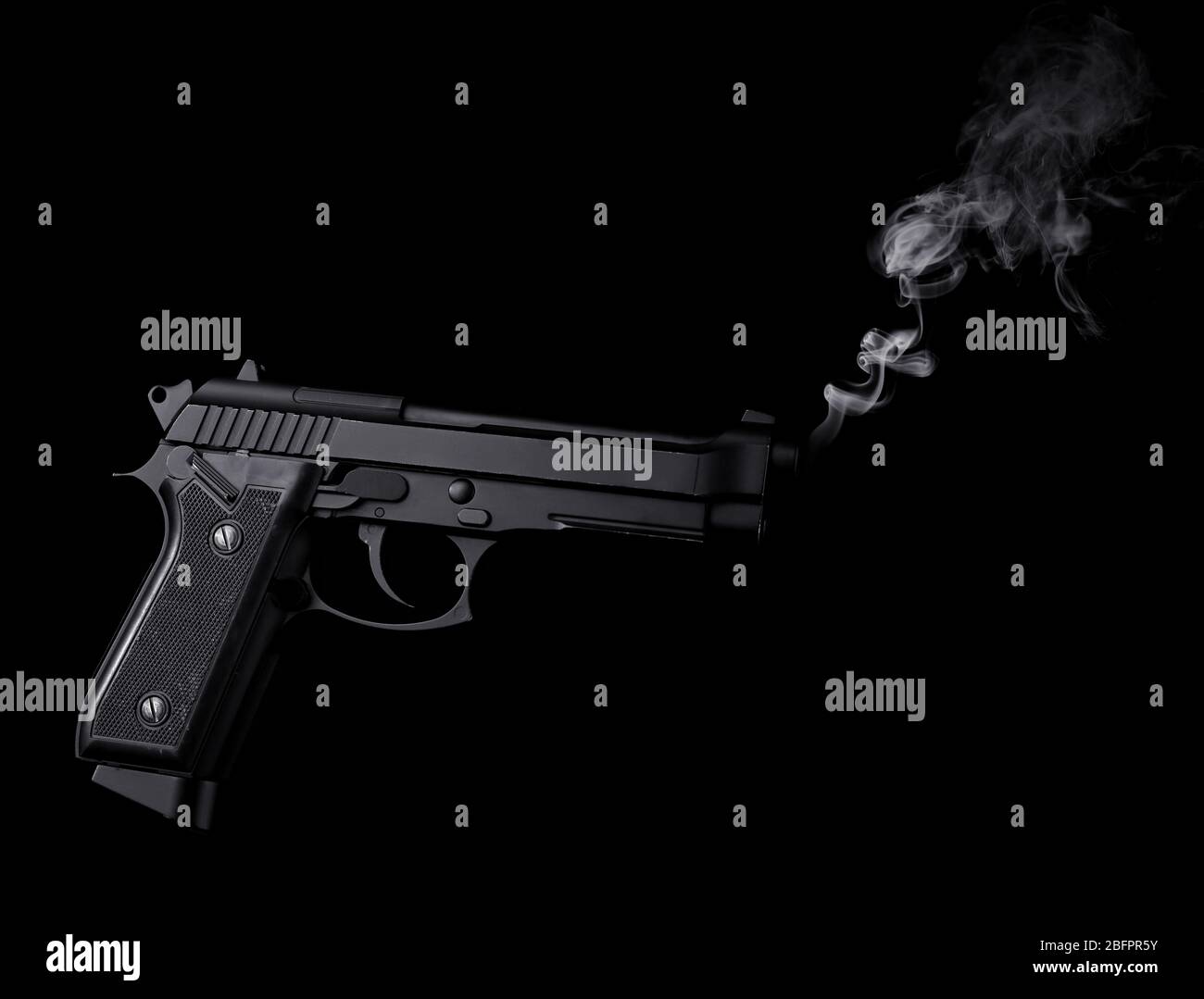 Smoking gun on black background Stock Photo - Alamy