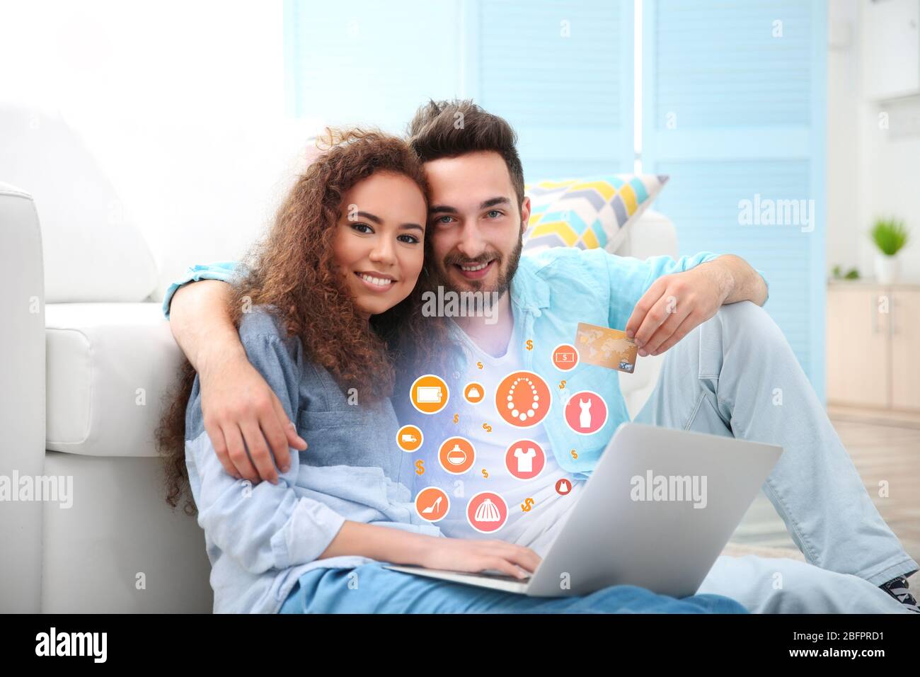 Young couple using laptop for browsing internet store at home. Online ...