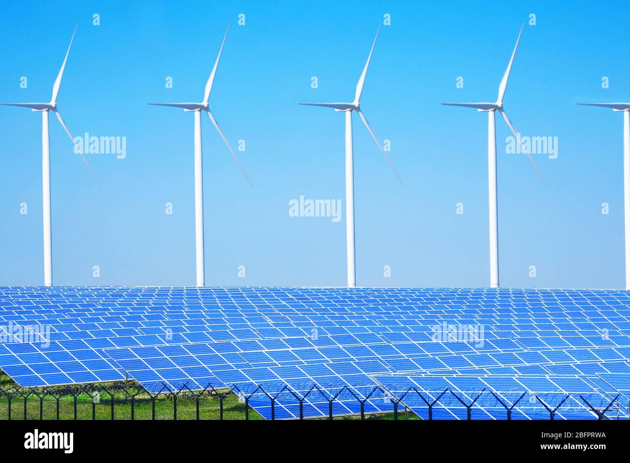 Wind turbines spin solar panels hi-res stock photography and images - Alamy