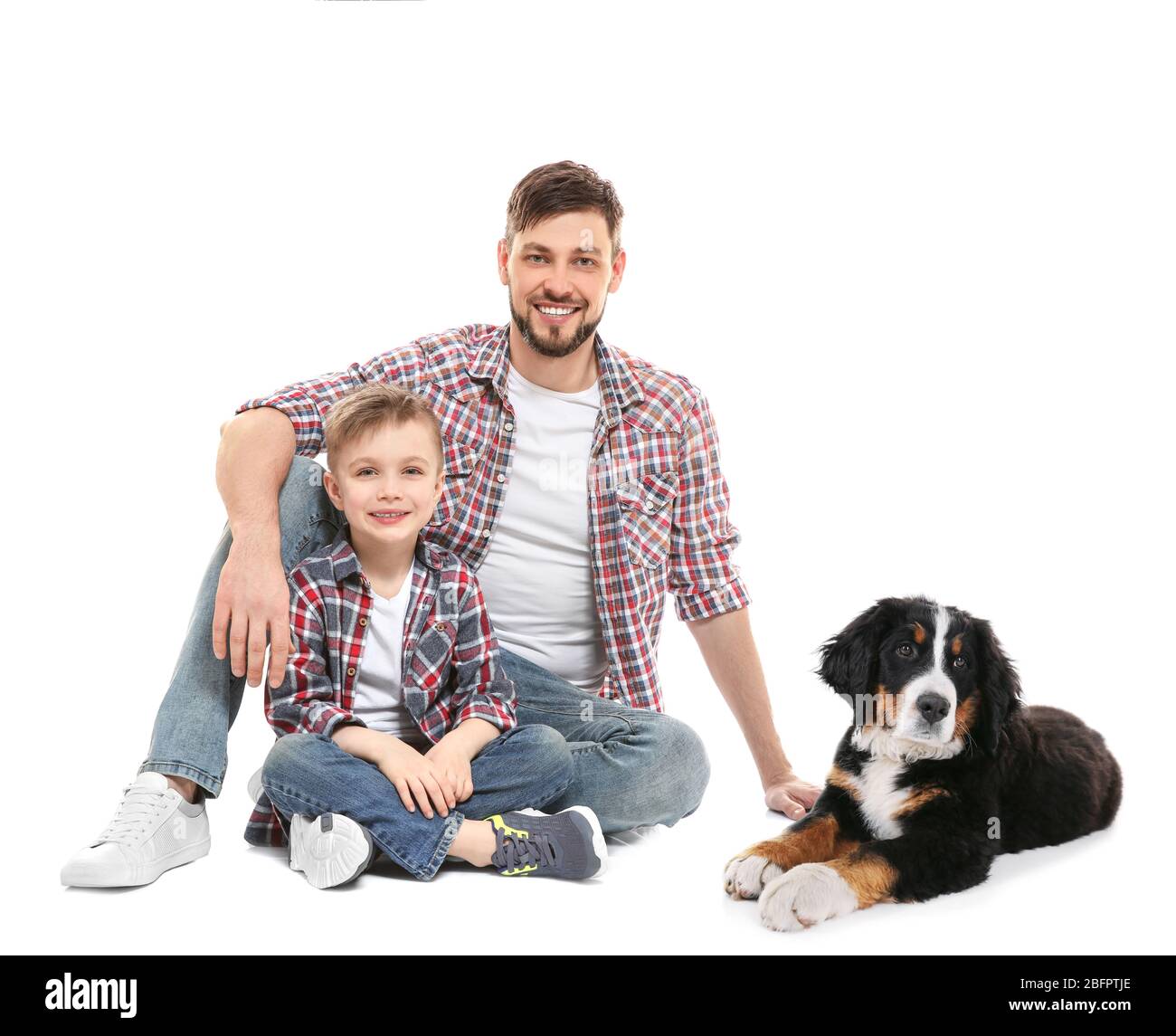 Father and son with dog on white background Stock Photo - Alamy