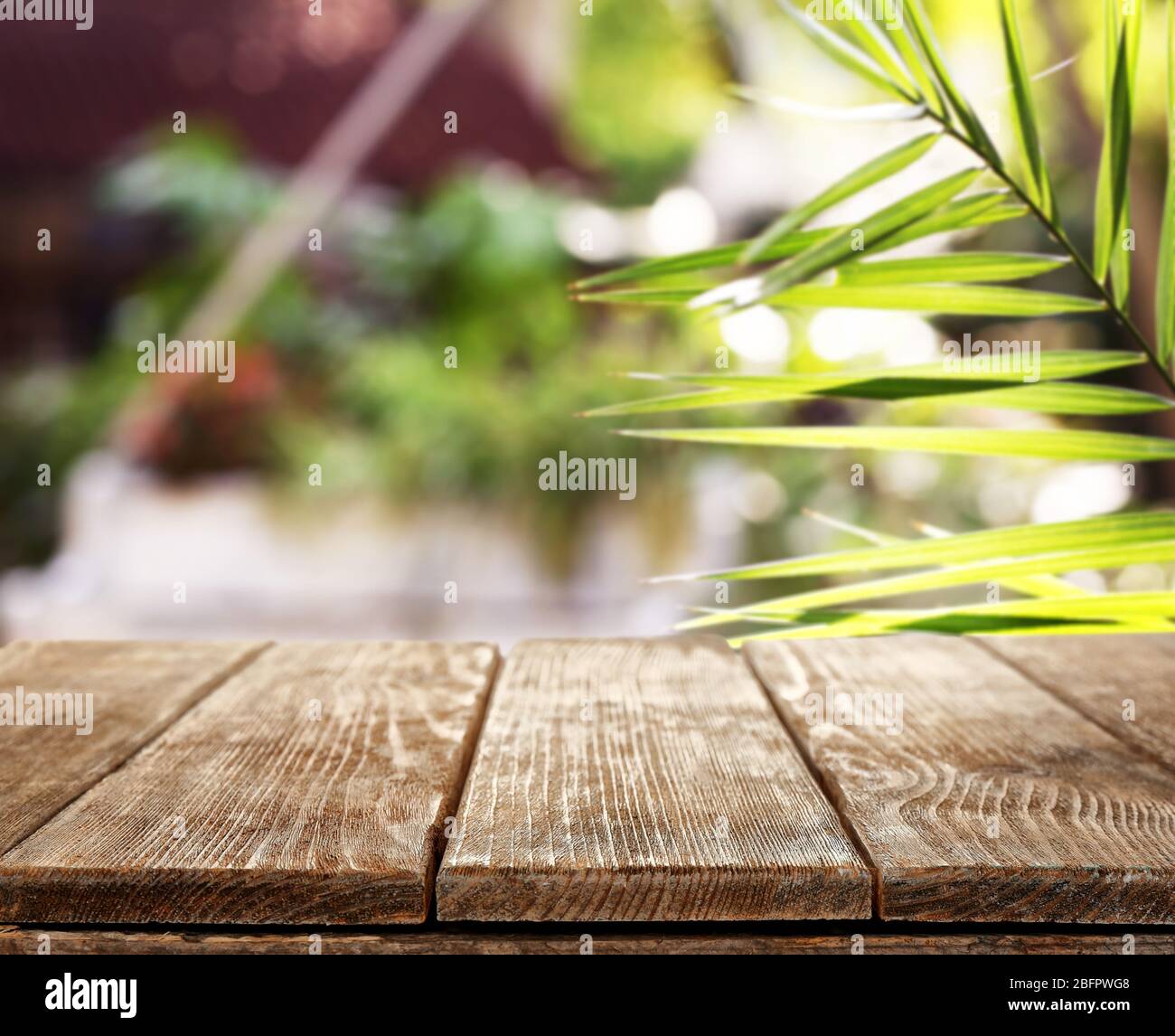 Empty wooden table on blurred background Stock Photo - Alamy