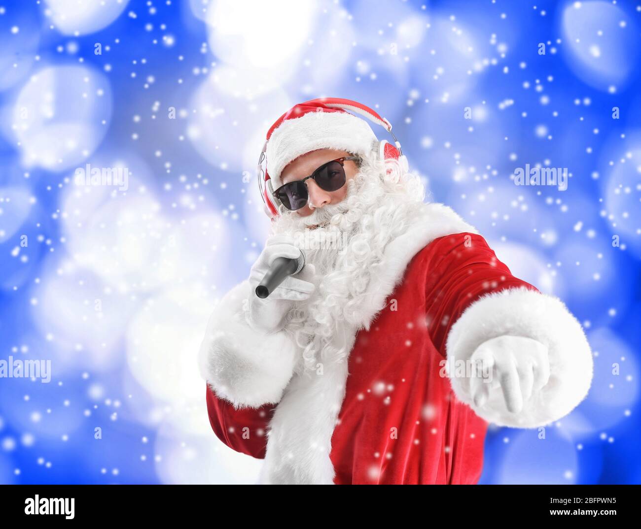 Santa Claus singing songs on blurred background. Christmas and New Year ...