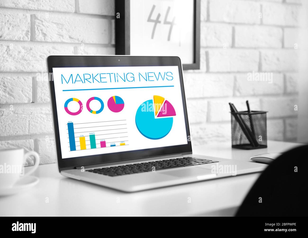 Office workplace with modern laptop. Marketing news on screen Stock ...