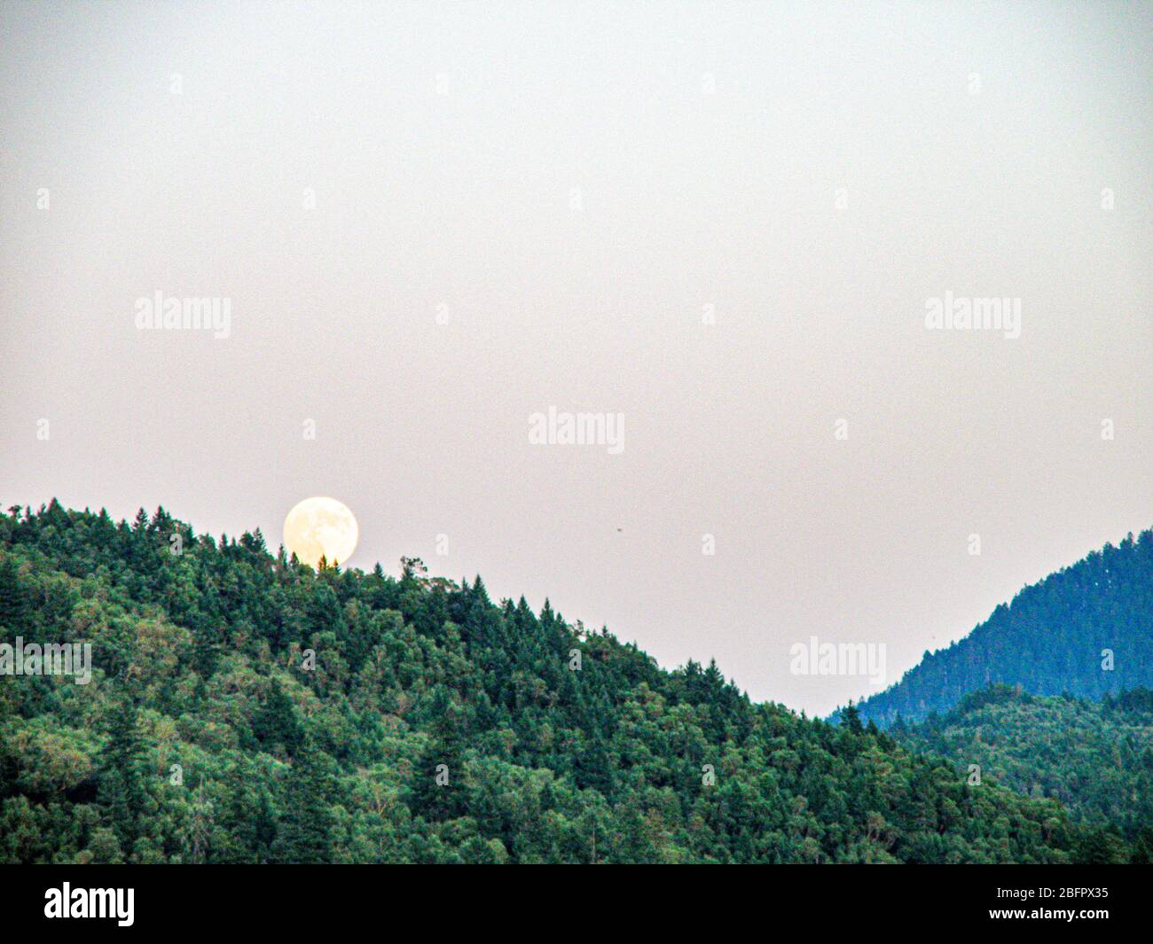 Moonrise over hill hi-res stock photography and images - Alamy