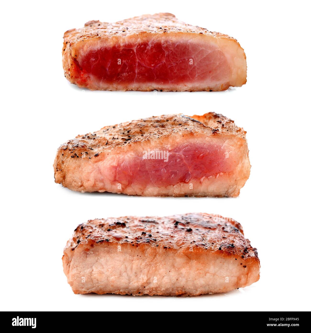 Different degrees of meat doneness on white background Stock Photo - Alamy