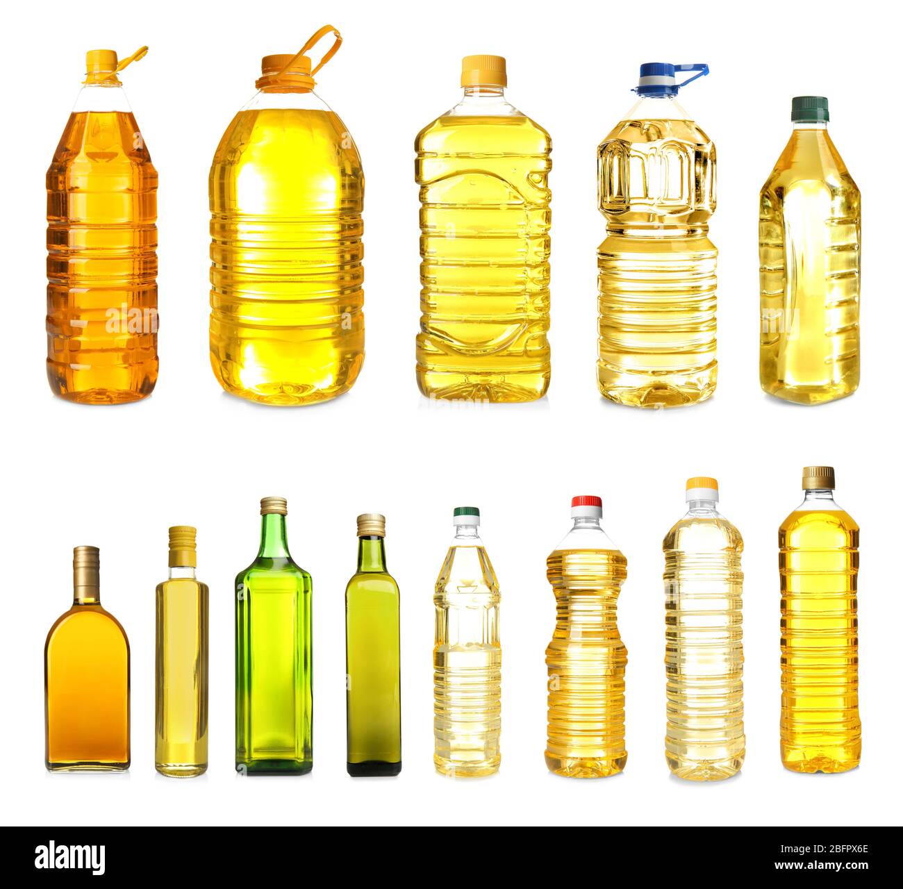 Different bottles with cooking oil on white background Stock Photo - Alamy