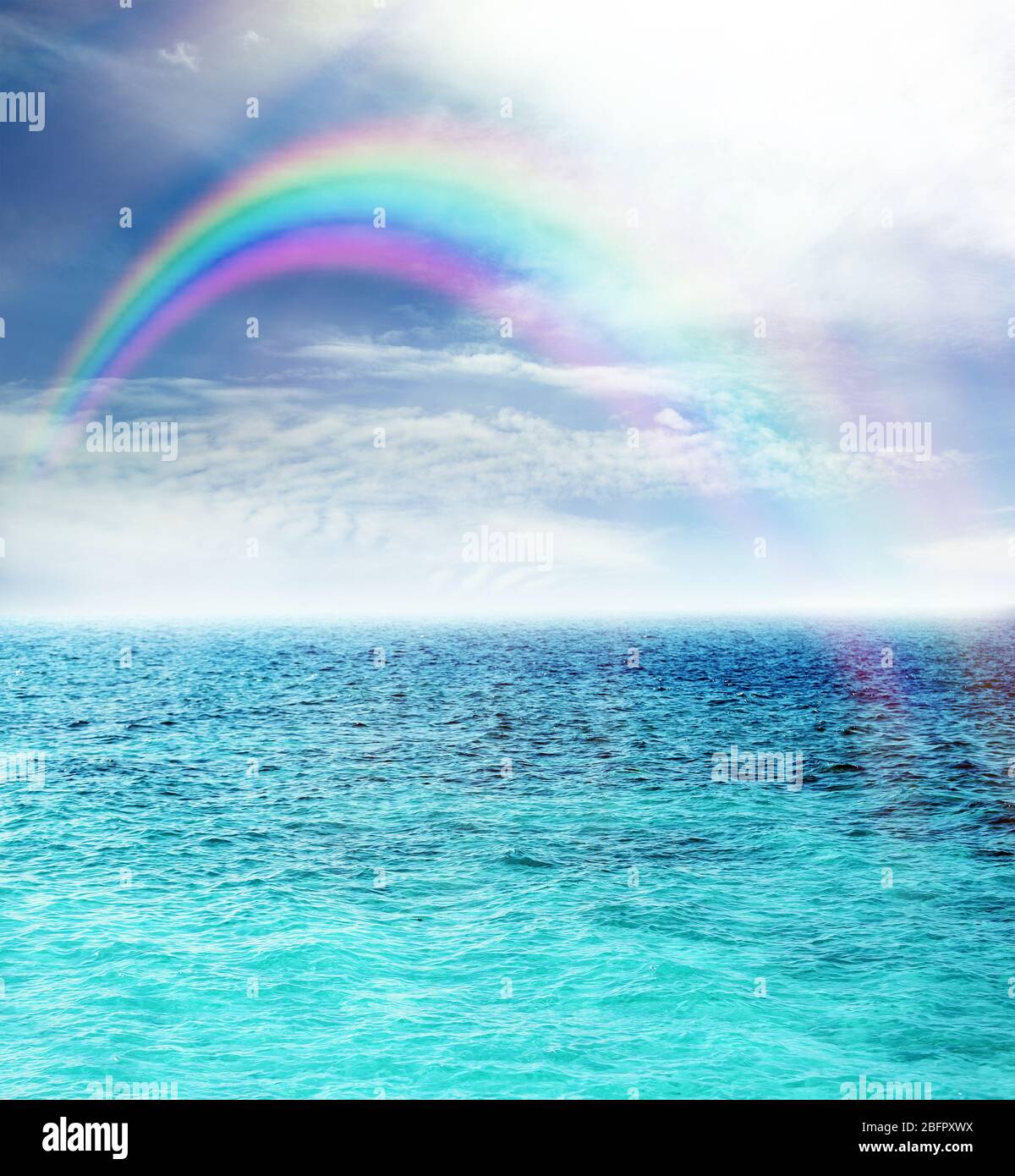 Ocean water and beautiful rainbow in sky Stock Photo - Alamy