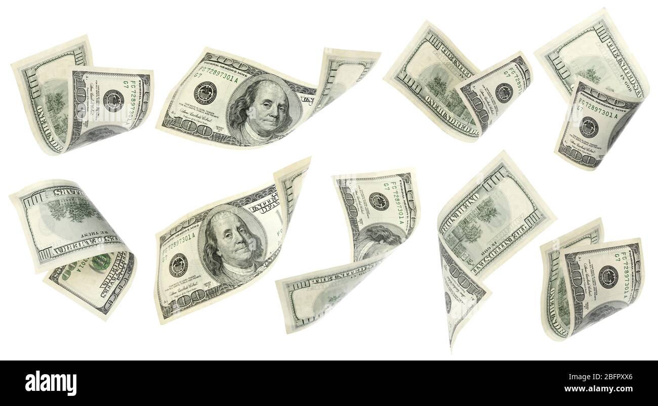 Flying money on white background Stock Photo - Alamy