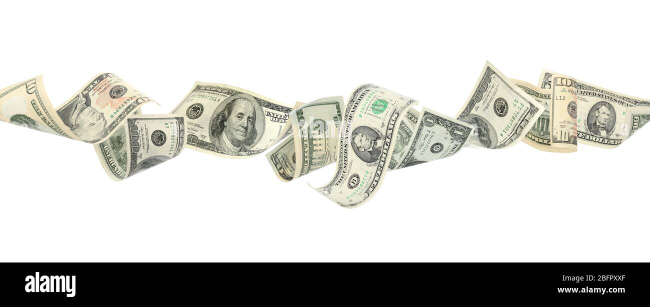 Flying money on white background Stock Photo - Alamy