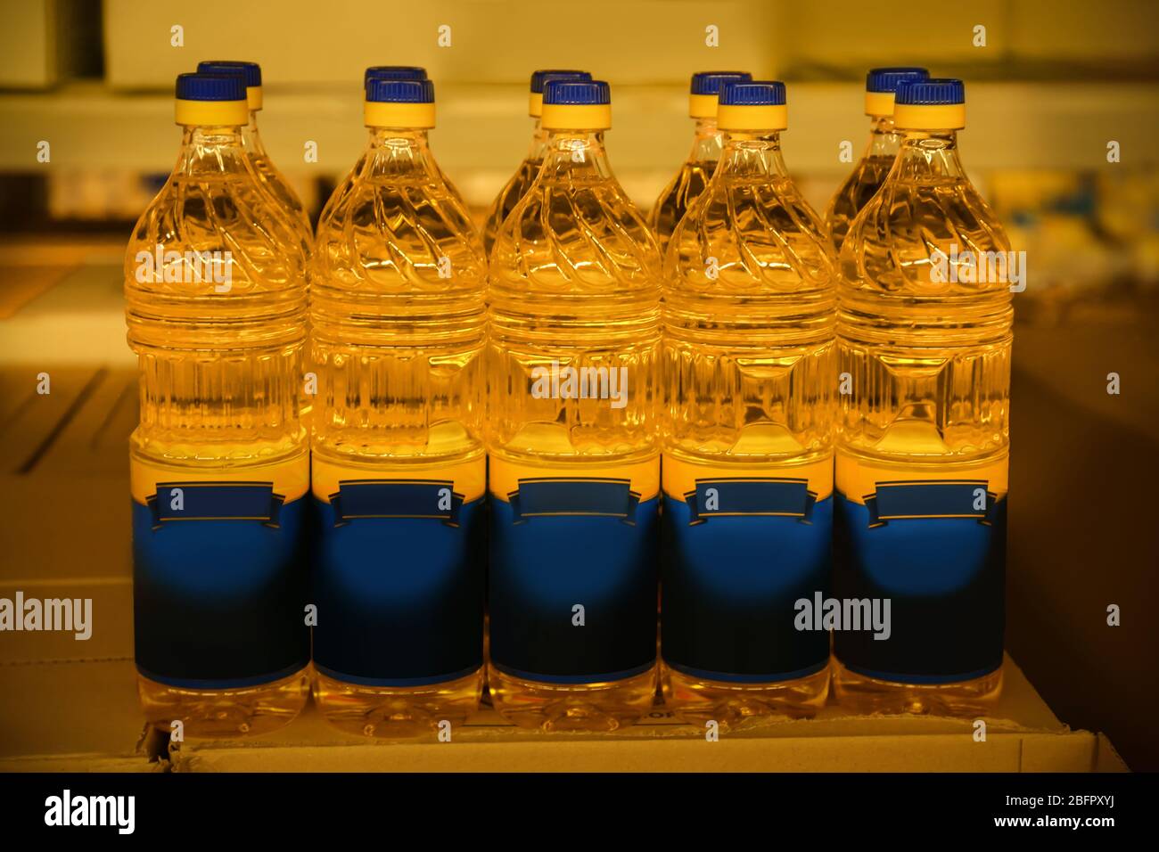Bottles with cooking oil on shelf in supermarket Stock Photo - Alamy