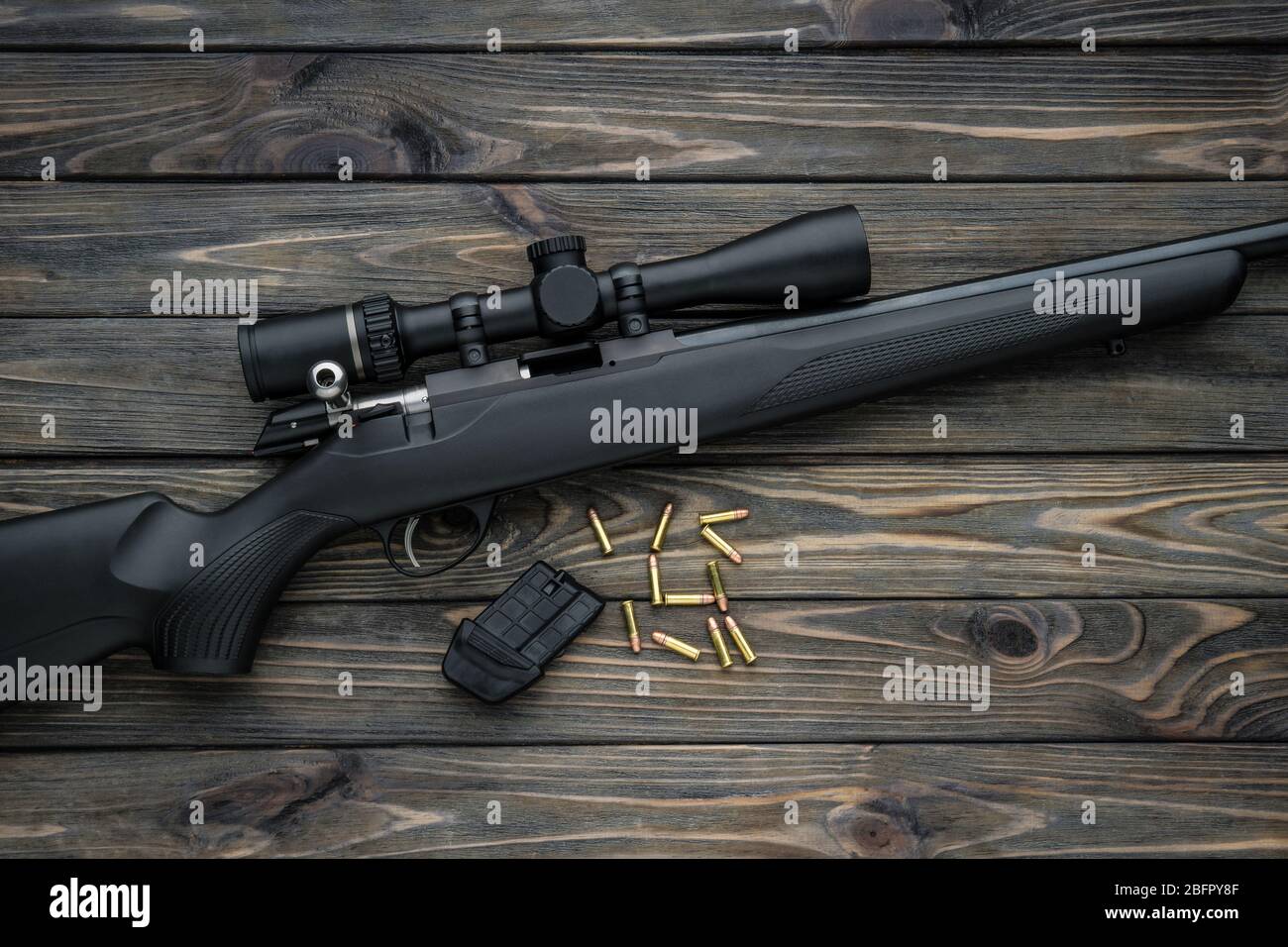 Bolt small caliber rifle 22lr with an optical sight on a wooden ...