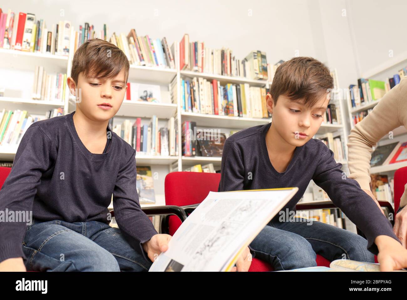 Children studying at school library Stock Photo - Alamy