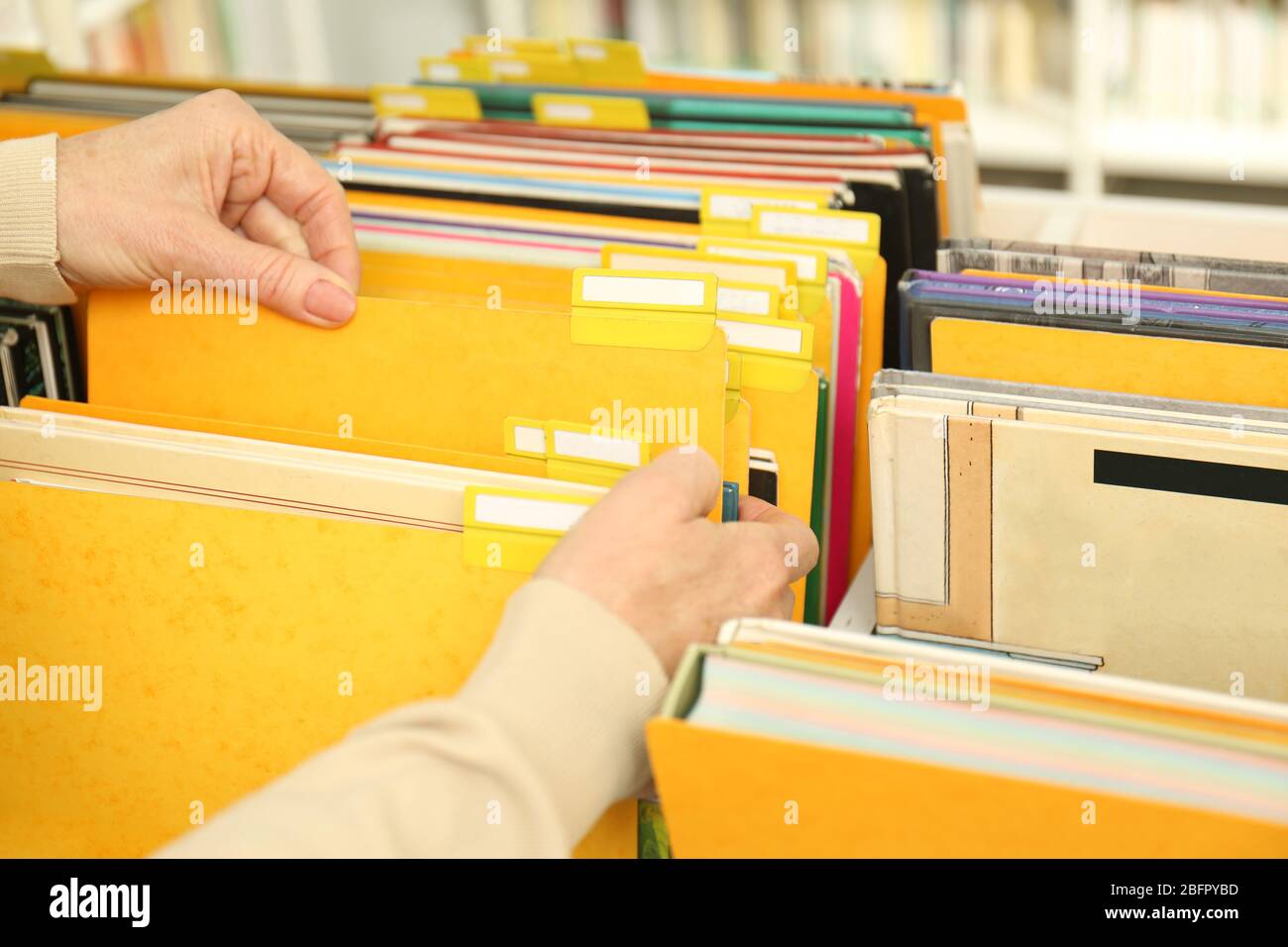 Senior librarian working at school library Stock Photo - Alamy