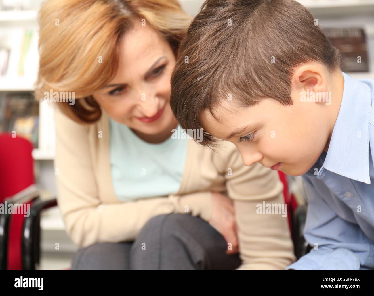 Teacher and little boy at school Stock Photo - Alamy