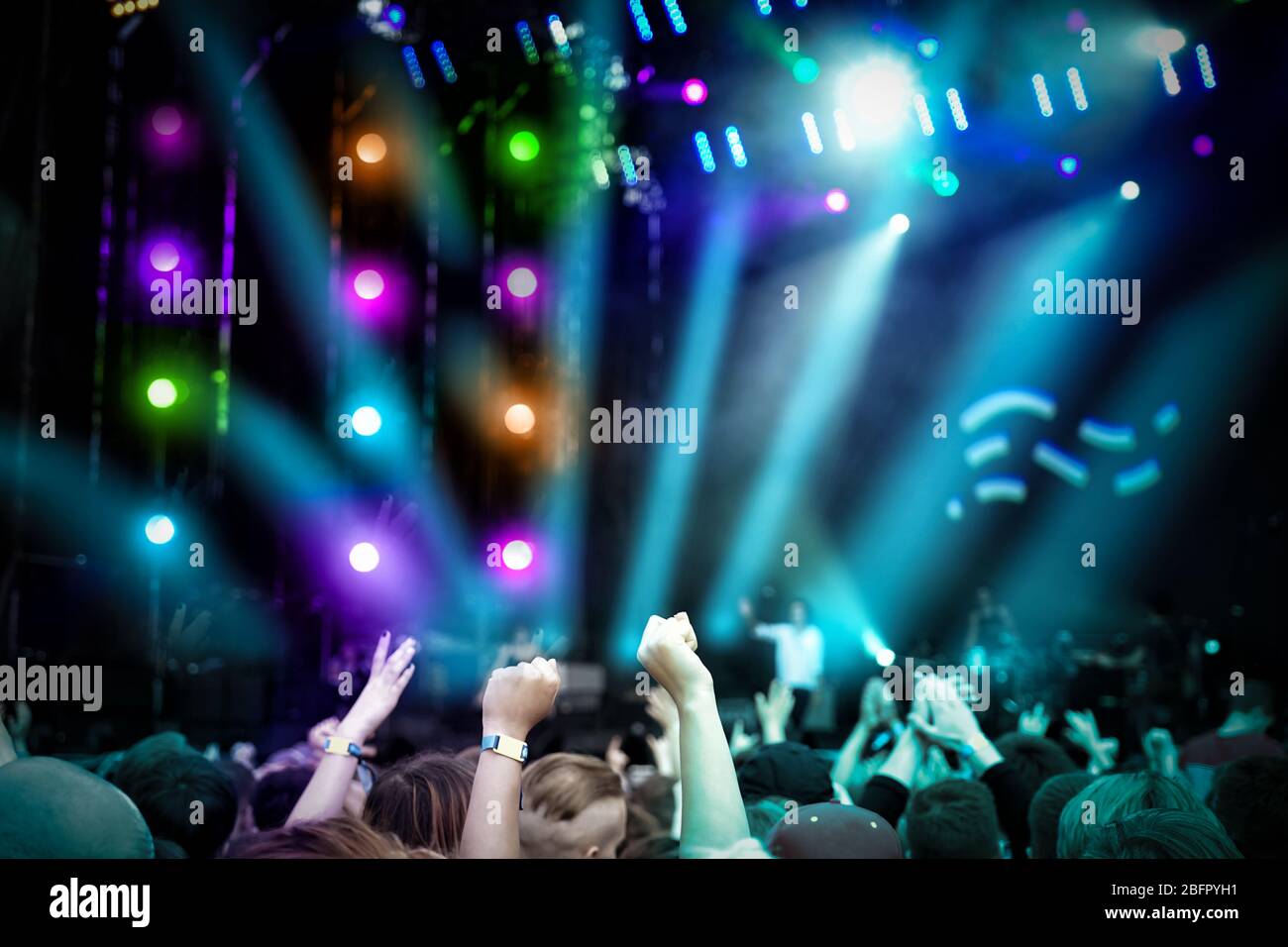 View of crowd and stage with colorful lights at concert Stock Photo - Alamy