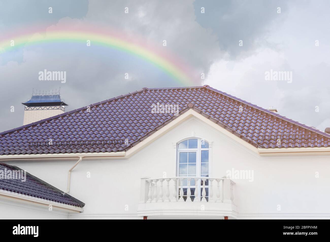 Beautiful rainbow over house Stock Photo - Alamy