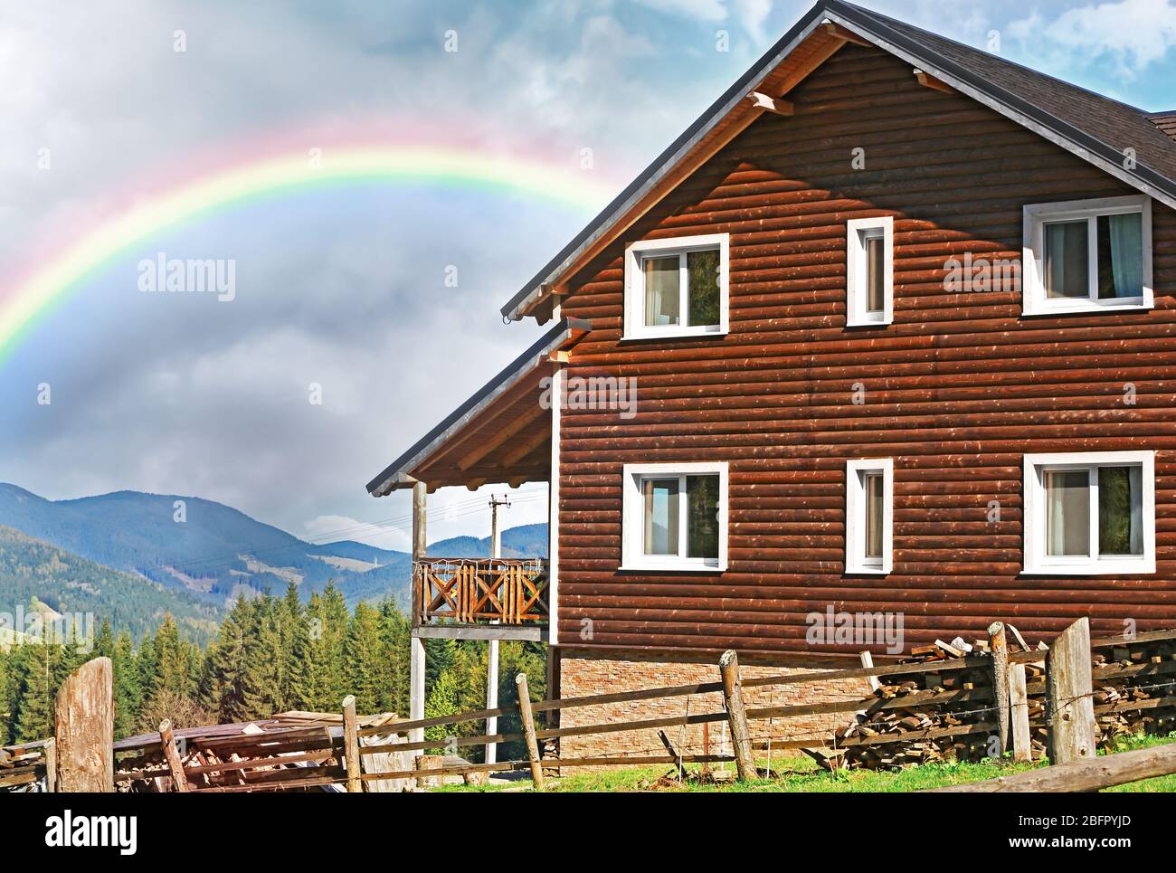 Beautiful rainbow over house Stock Photo - Alamy
