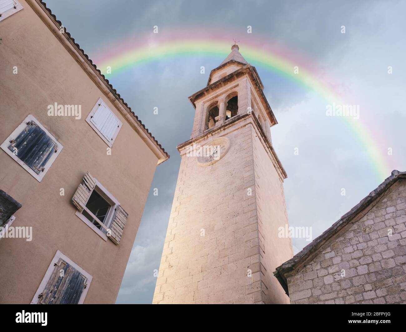 Beautiful rainbow over city Stock Photo - Alamy