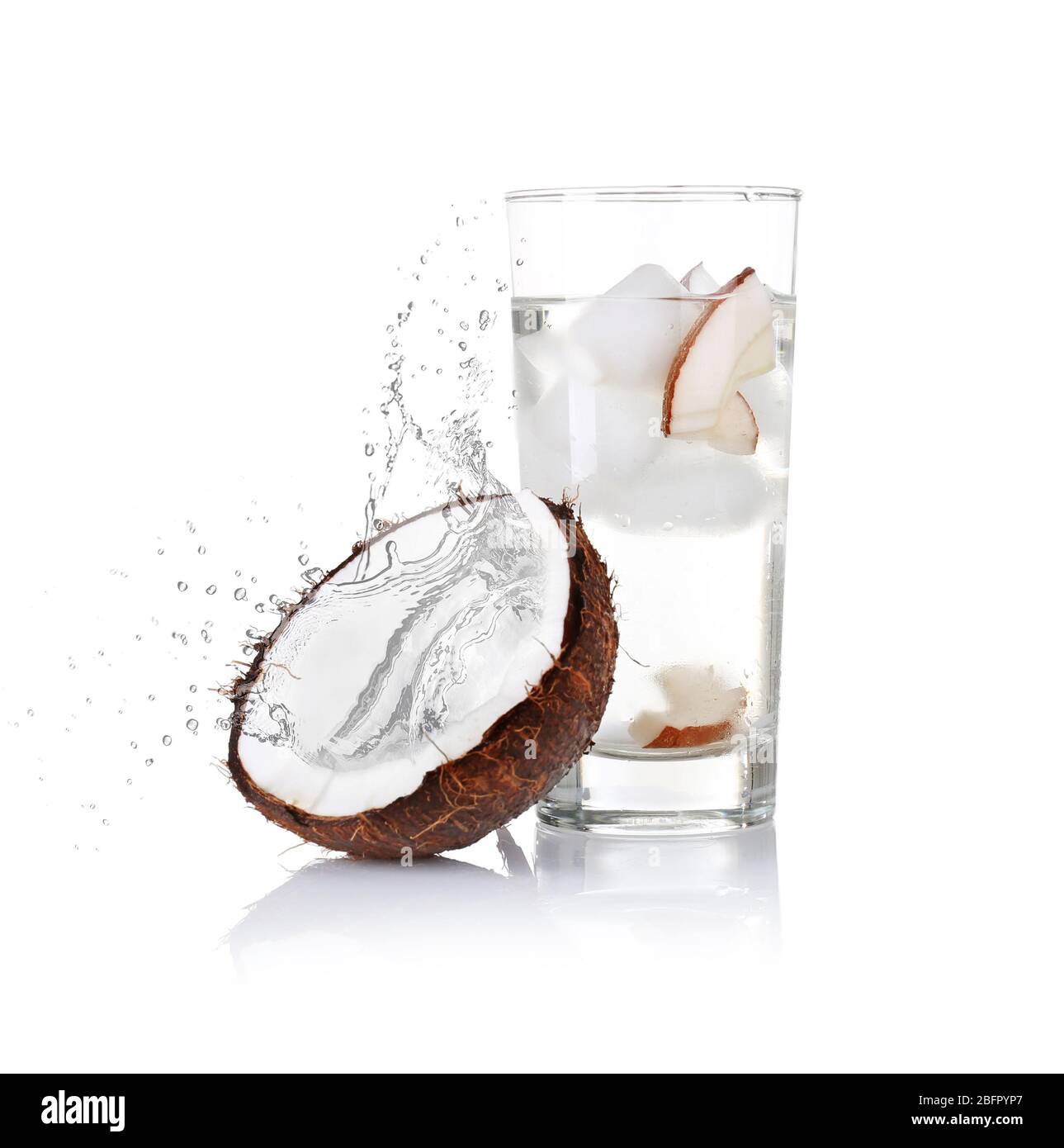 Glass of coconut water and nut on white background Stock Photo - Alamy