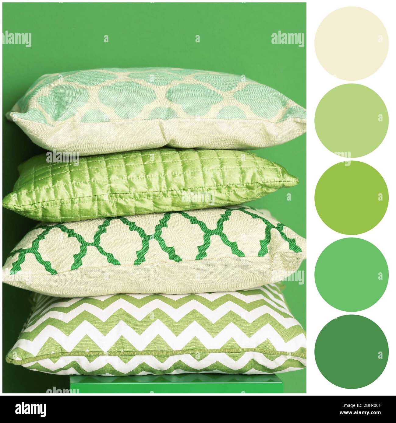 Color palette and soft pillows on green background Stock Photo - Alamy