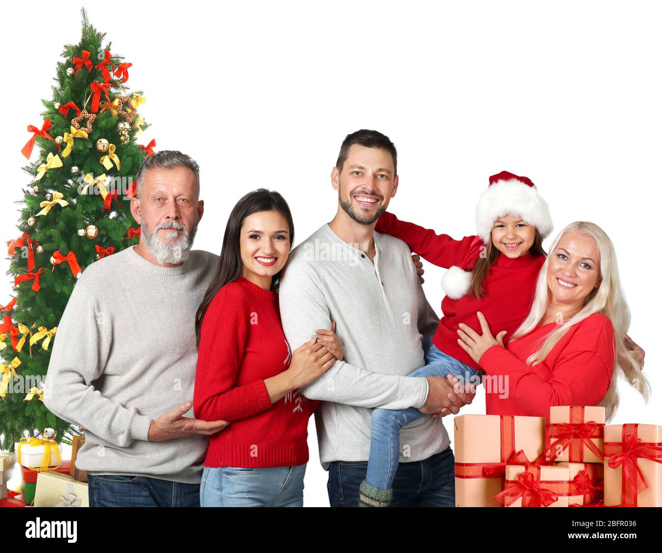 Happy family with gift boxes and decorated Christmas tree on white ...