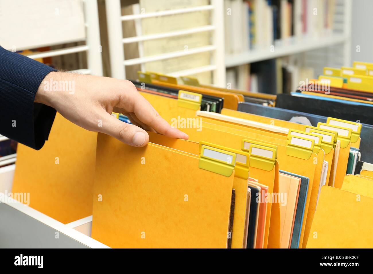 Man looking folders documents hi-res stock photography and images - Alamy