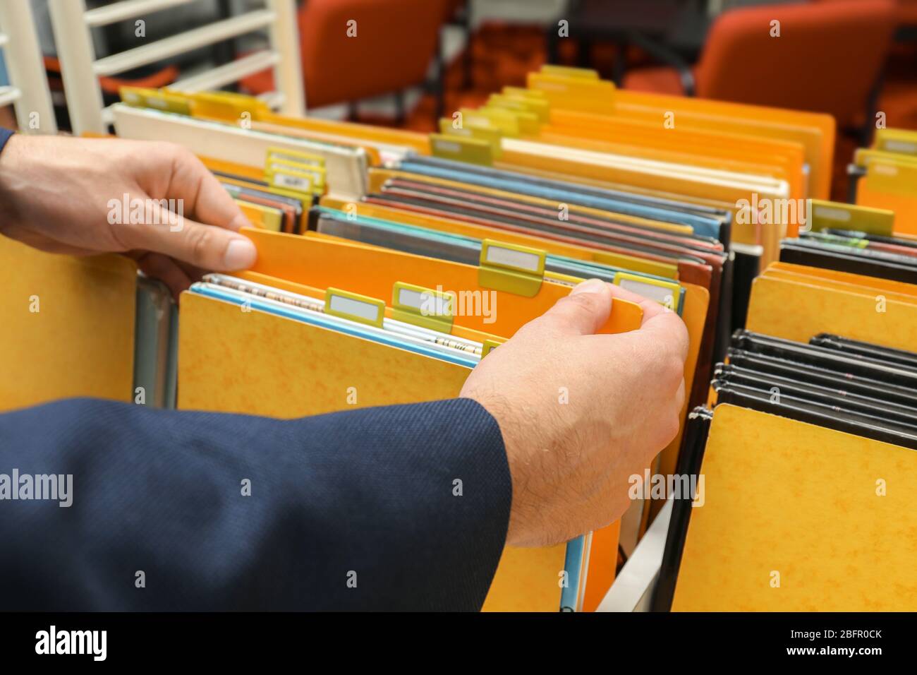 Man looking folders documents hi-res stock photography and images - Alamy