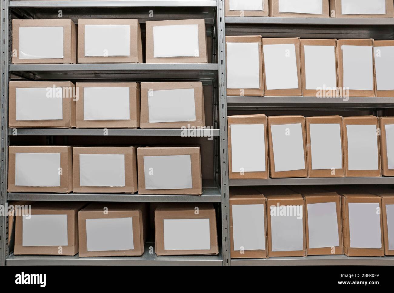 Cardboard boxes with documents on shelving unit in archive Stock Photo ...