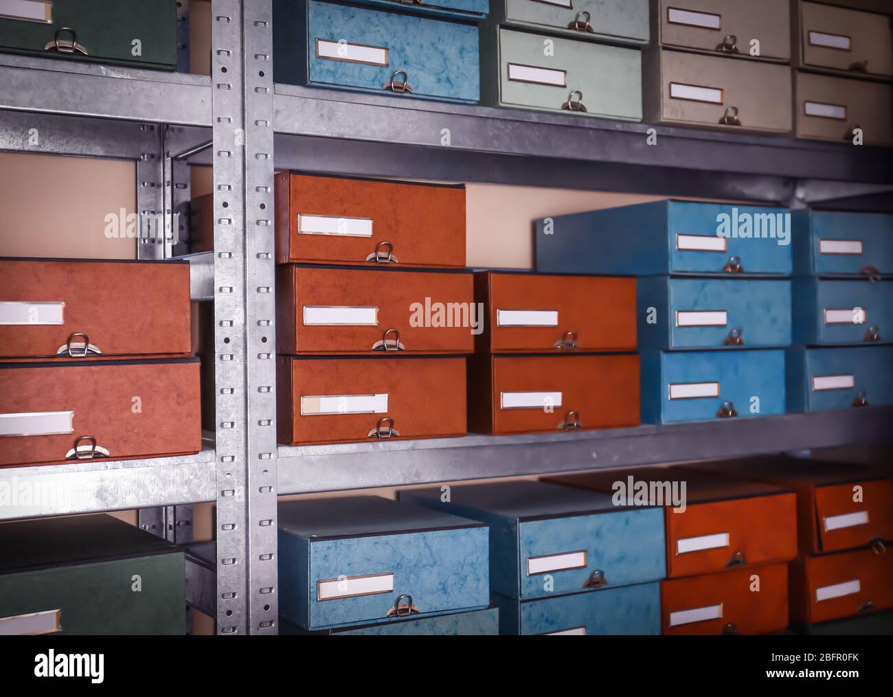 Cardboard boxes with documents on shelving unit in archive Stock Photo ...